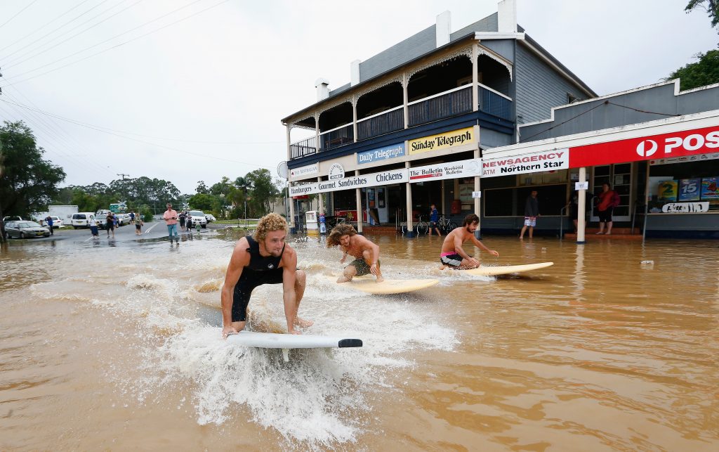 Residents surf down the street in Australia - First News Live!